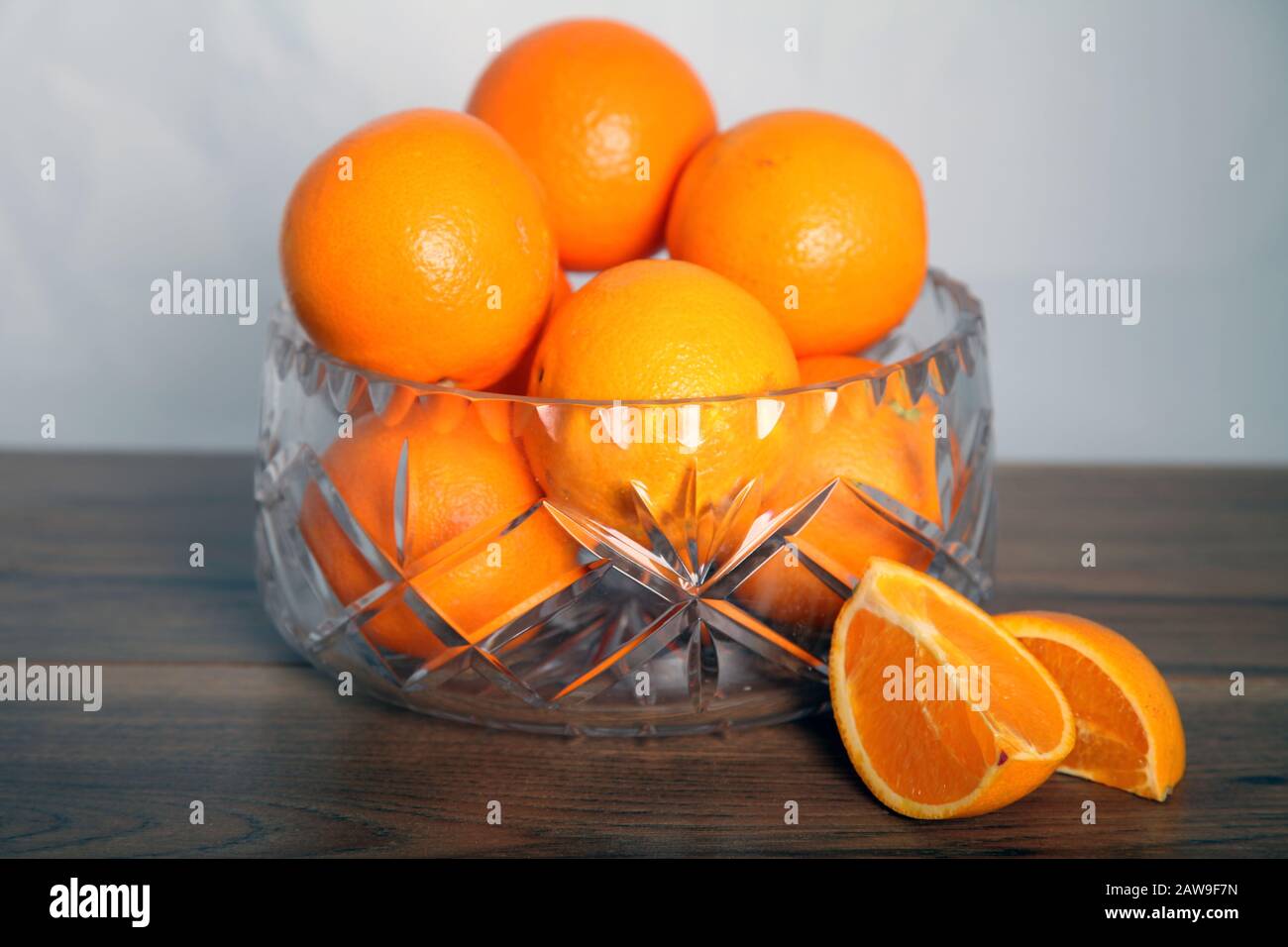 Lead crystal fruit bowl full of oranges 'fruit' against white ...