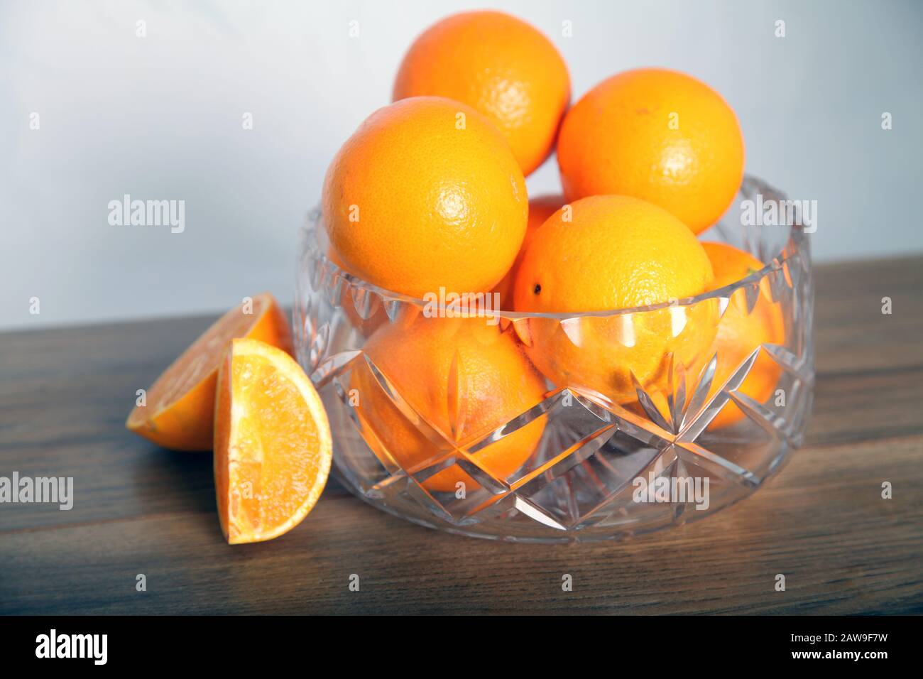 Lead crystal fruit bowl full of oranges 'fruit' against white ...
