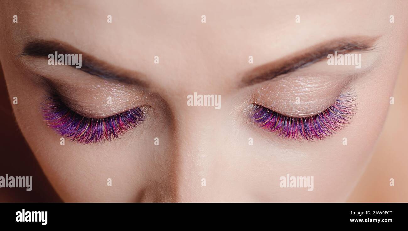 Eyelash extension procedure. Large eyes closed beautiful girls with ...