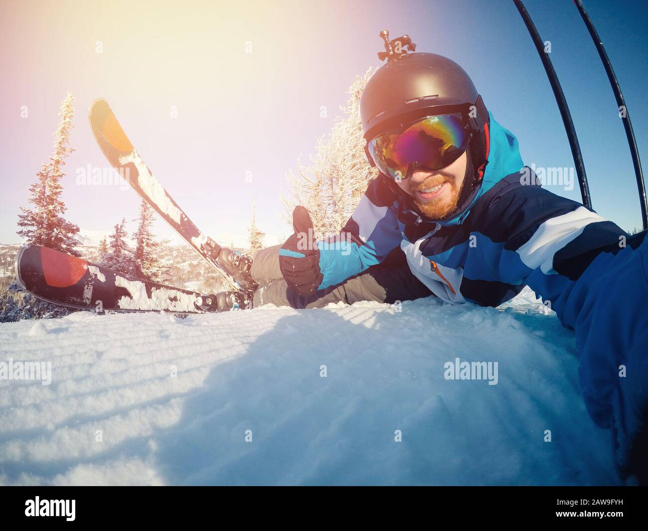 Selfie Guy sportsman goes on normal skiing on ski slope with action ...