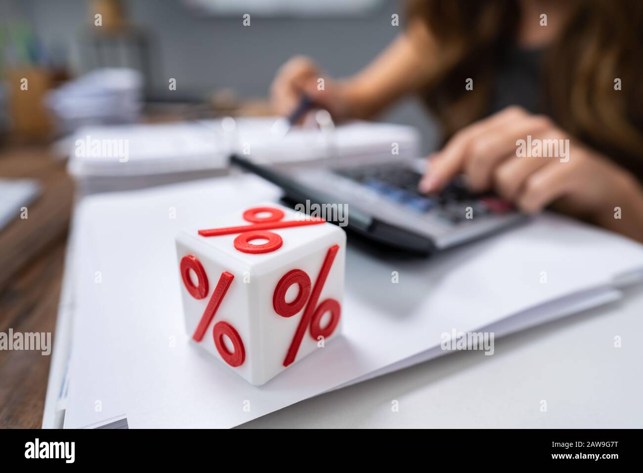 Close-up Of White Block With Percentage Symbol While Businessperson ...