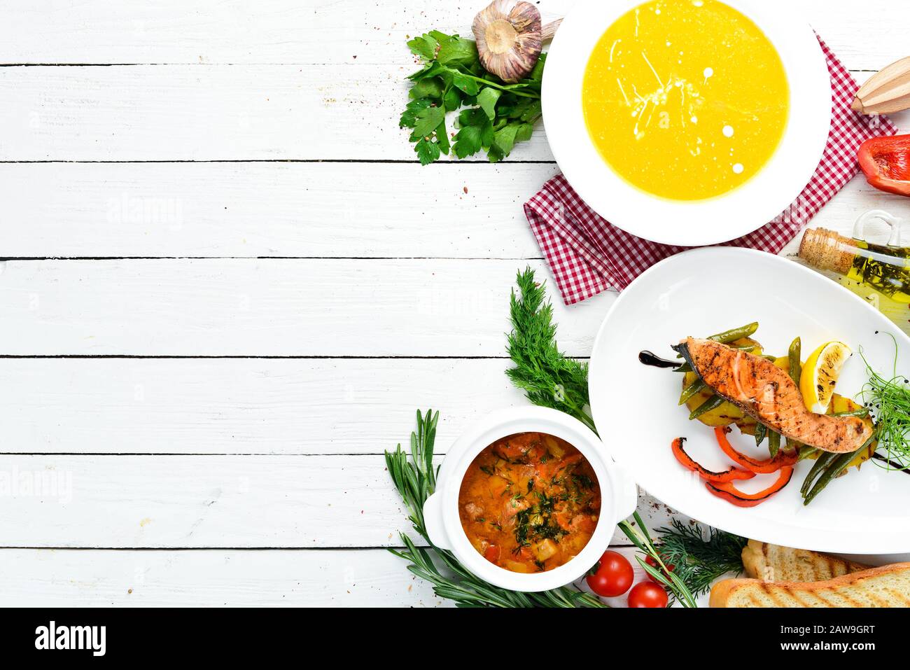 Food background. Fish, pumpkin and meat dishes. Top view. Free space ...