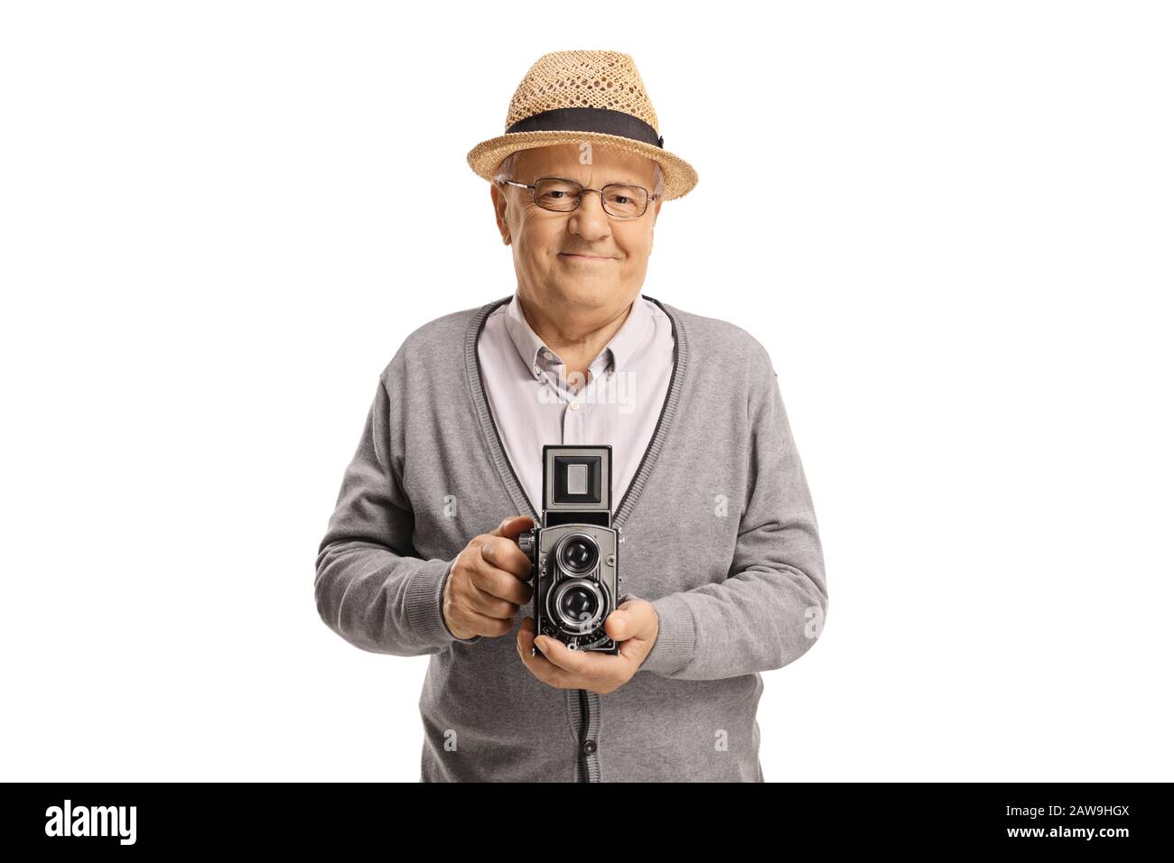 Elderly man holding an old-fashined vintage camera isolated on white ...