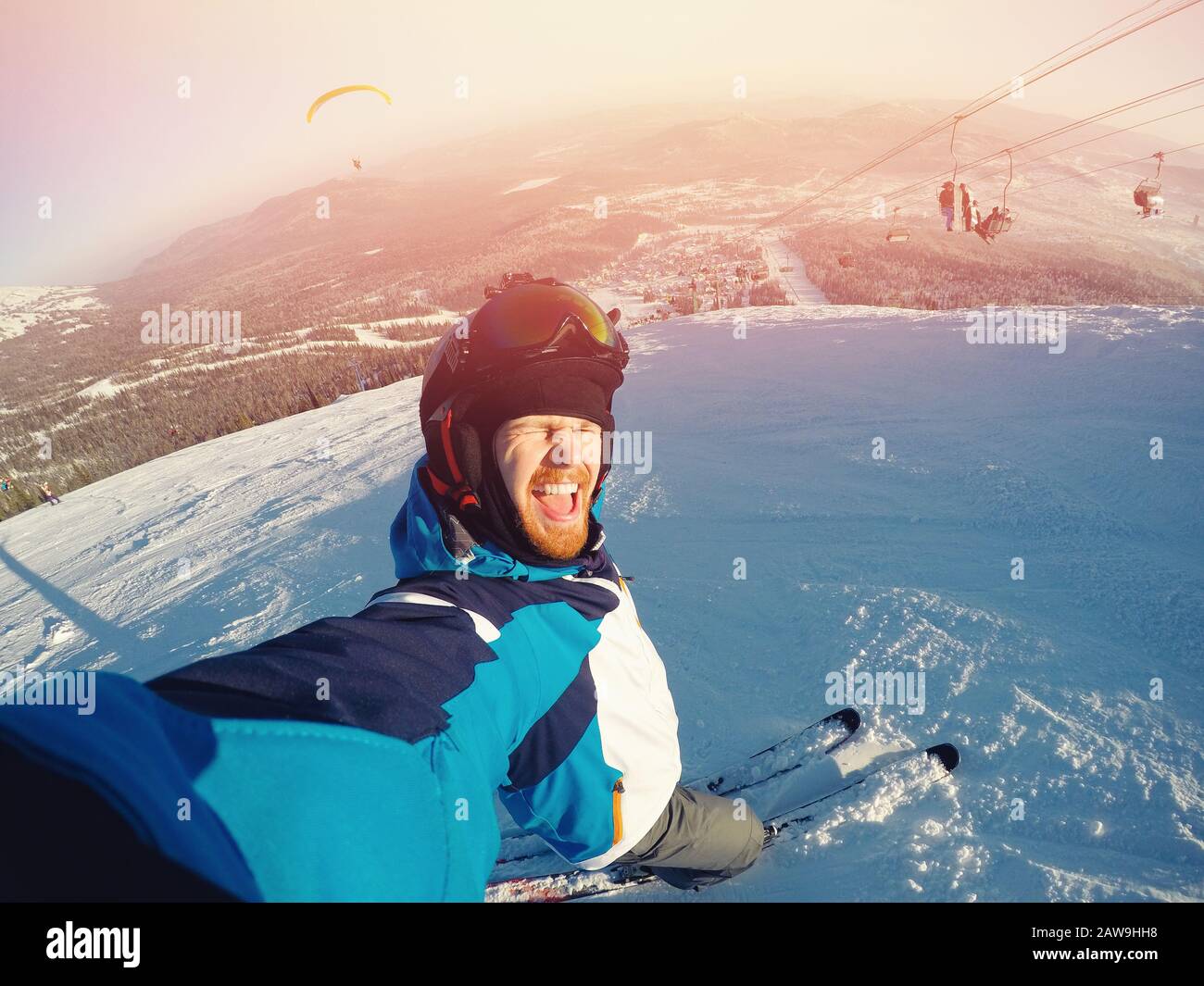 Selfie Guy sportsman goes on normal skiing on ski slope with action ...