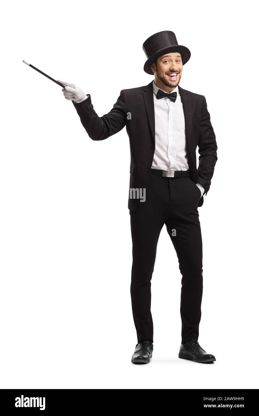 Full length portrait of a smiling happy magician pointing with a magic ...
