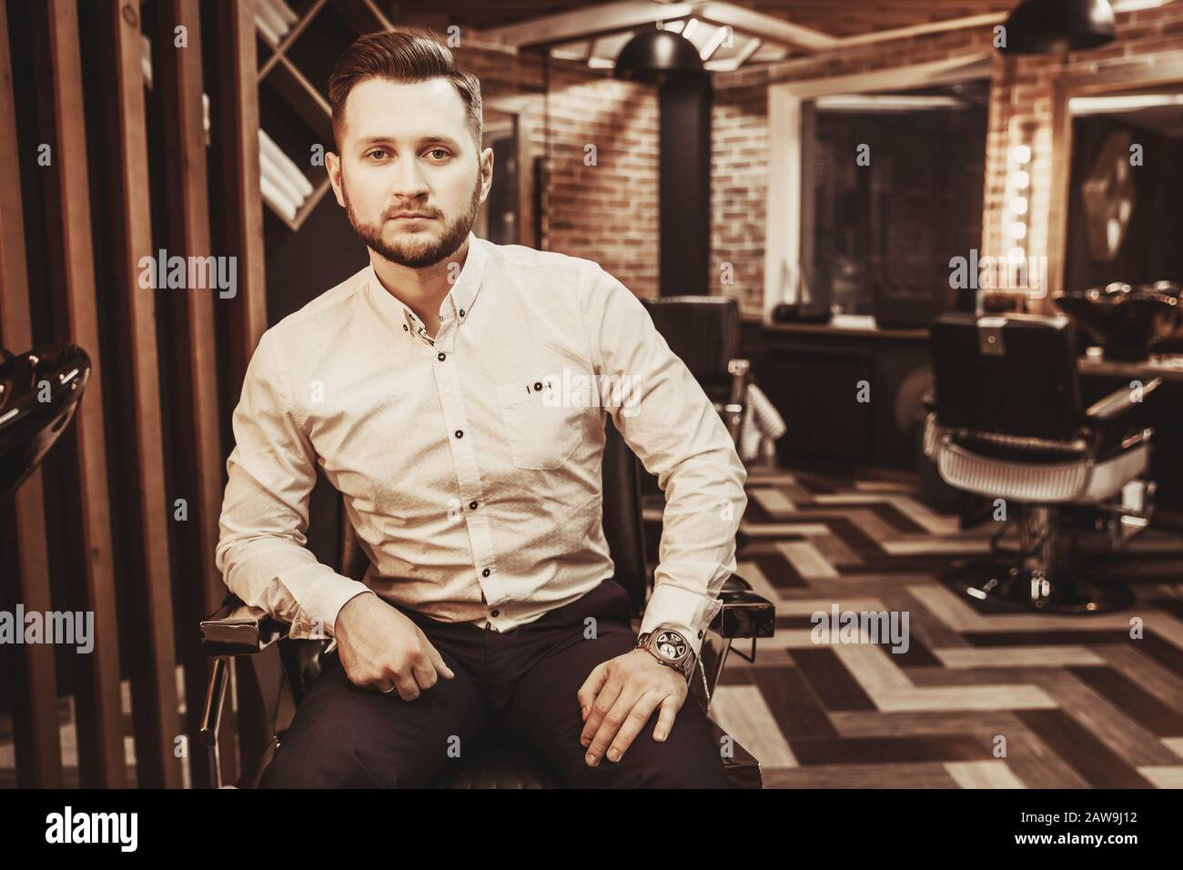 Barbershop, Man with beard in barber shop. Modern hair salon Stock ...