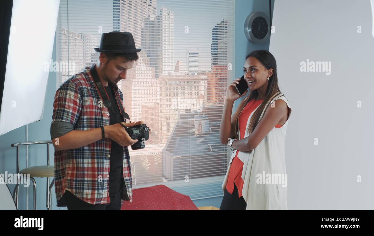 Professional photographer asking model to stop talking on smartphone ...
