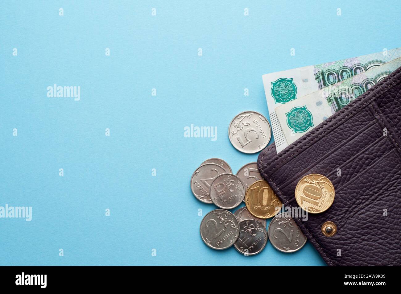 Russian rubles in the wallet on a blue background. Thousand notes and ...
