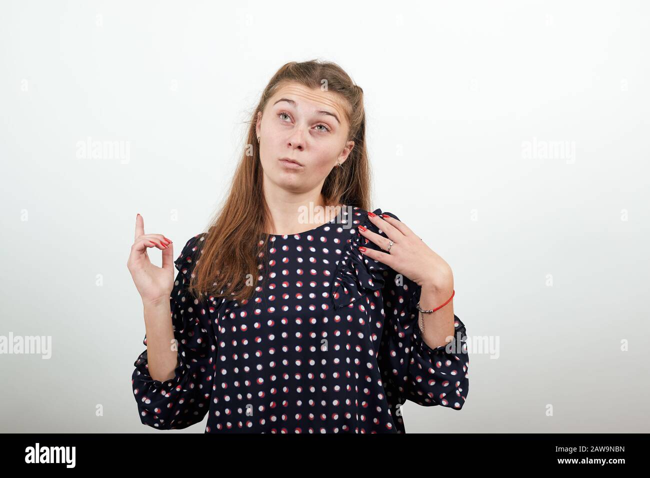 girl thinks solving problem with smart facial expression Stock Photo ...