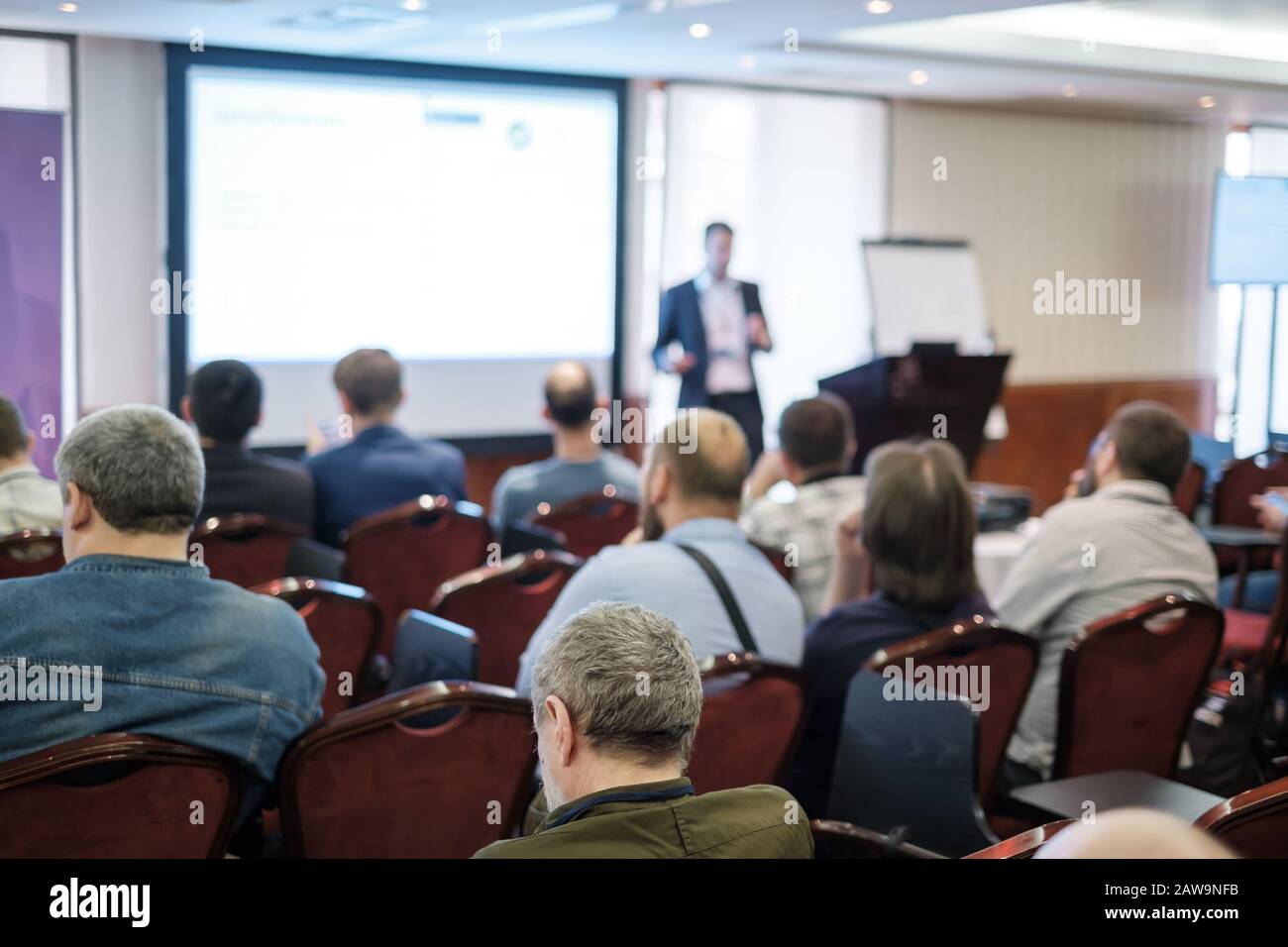 Business conference attendees sit and listen Stock Photo - Alamy