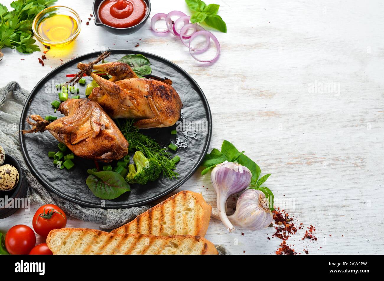 Baked quail with vegetables. Flat lay. Top view. Free copy space Stock ...