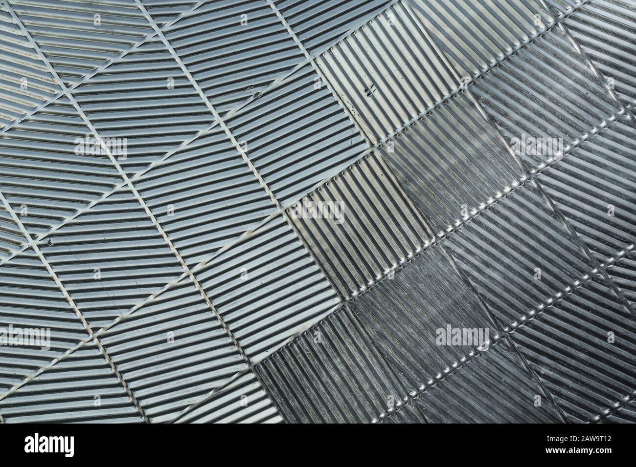 Metallic tiles on an urban wall Stock Photo - Alamy