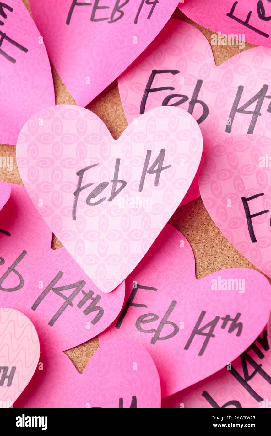 Handwritten Valentine's Day reminders for Feb 14th on pink hearts stuck ...