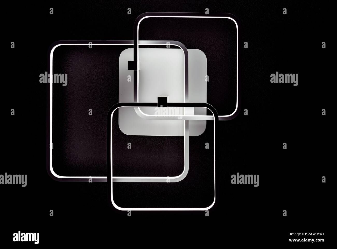 Square LED wall lights on a black background. LED lighting in a modern ...