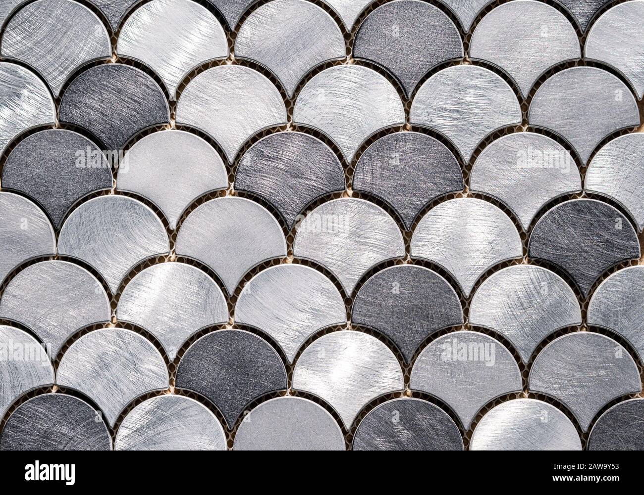 Metal mosaic tile in the form of scales. Silvery tile texture with ...