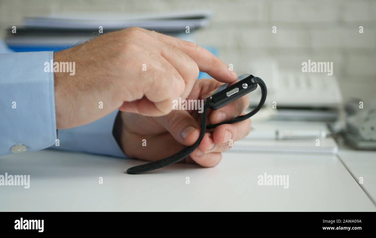 Businessman at Workplace Check Time and Phone Messages Using His ...