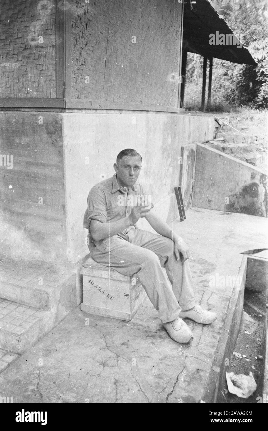 Man sits on traditional Black and White Stock Photos & Images - Alamy