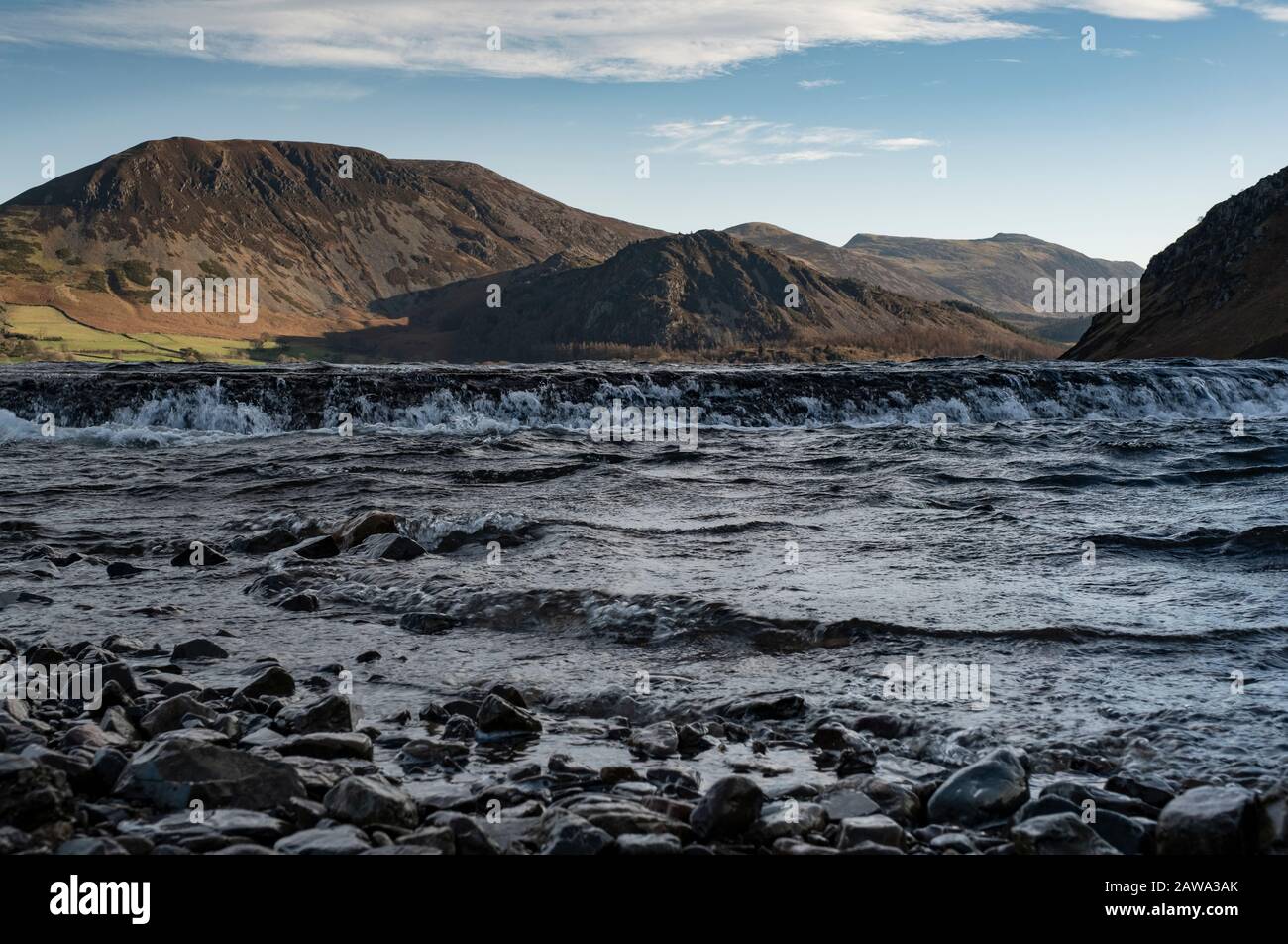 Windy conditions blow water over the overflow on Ennerdale Water in the ...