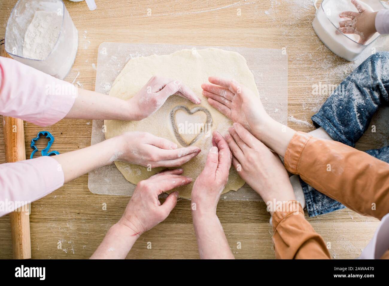 cooking and home concept - close up of female hands making cookies from ...