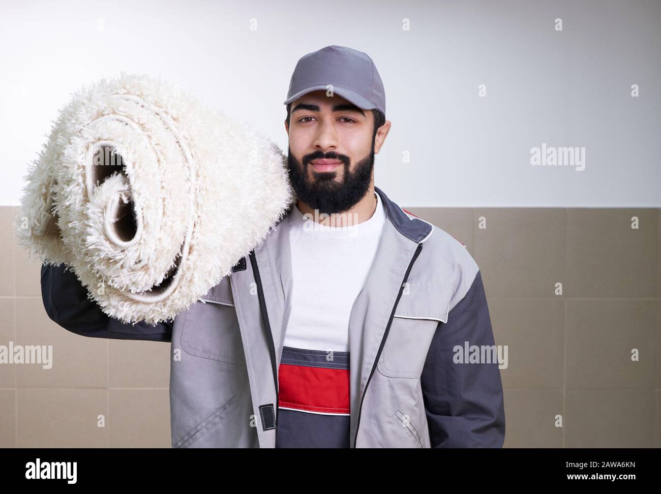 Man carrying rolled carpet hi-res stock photography and images - Alamy