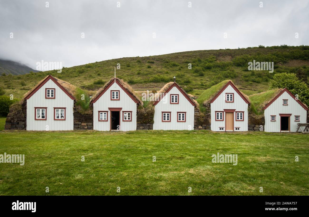 Traditional old turf houses with moss rooftops in rural Iceland near ...
