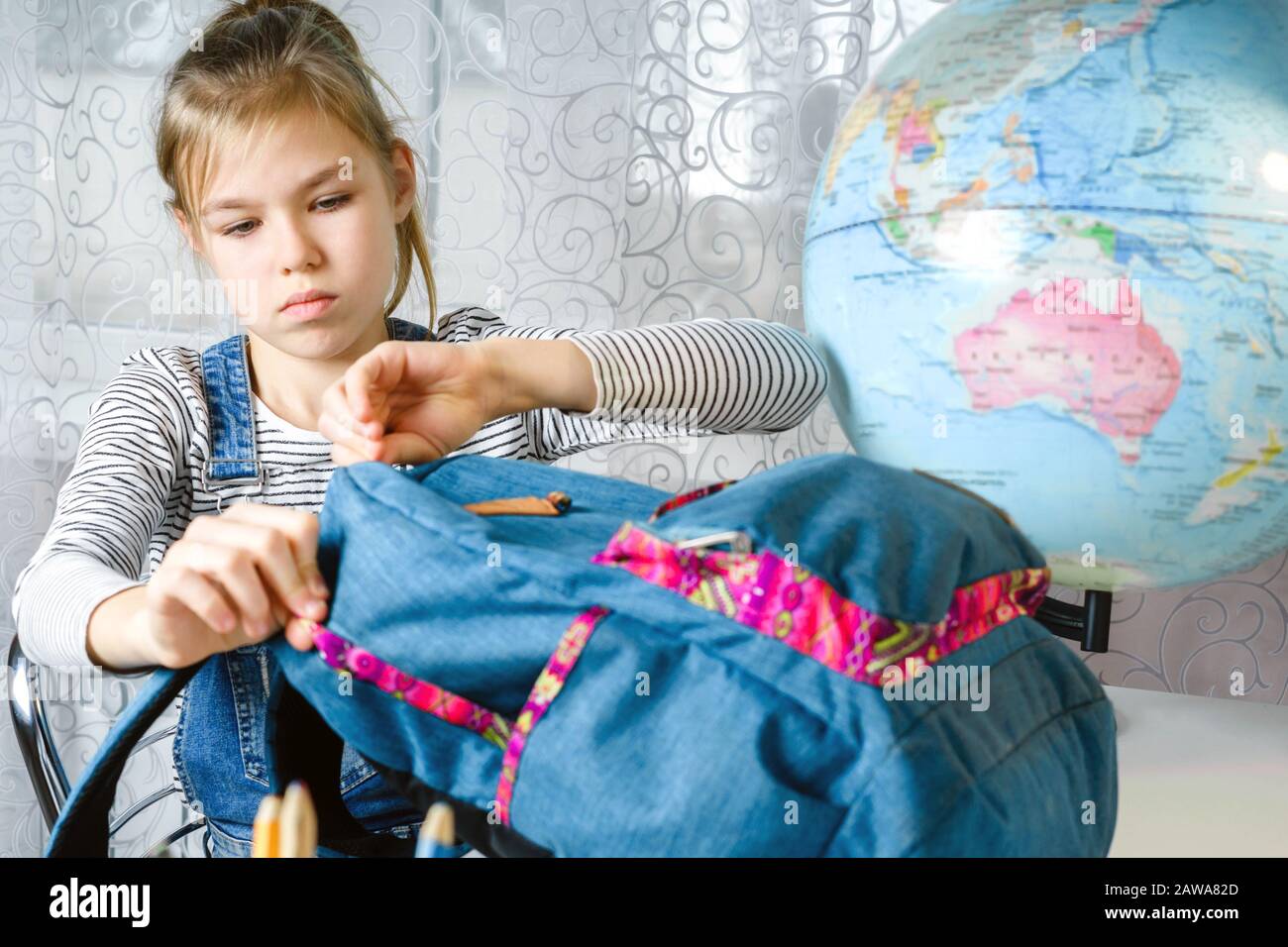Girl packing backpack school hi-res stock photography and images - Alamy