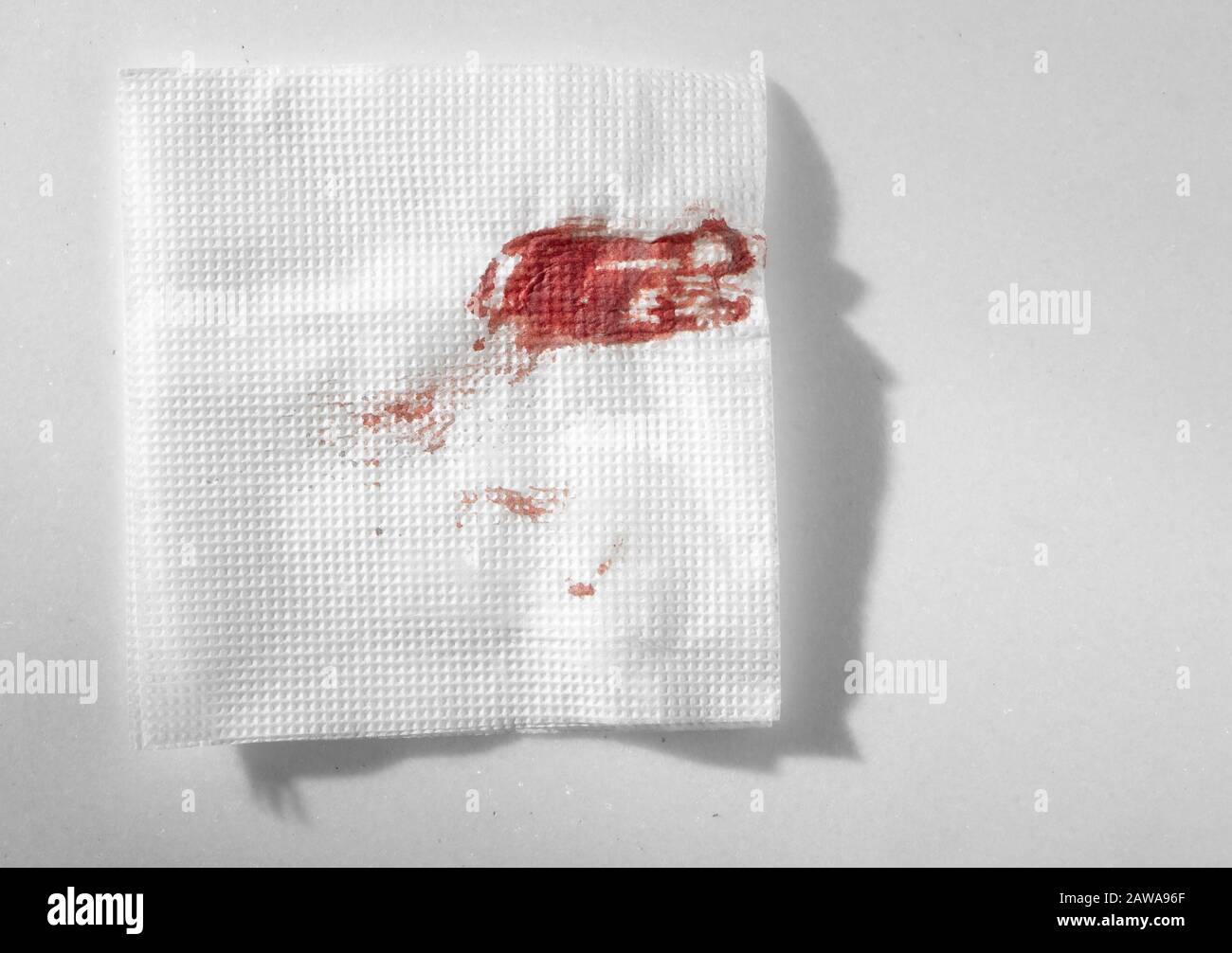 Kitchen paper napkin in the blood. Stopping blood by improvised means ...