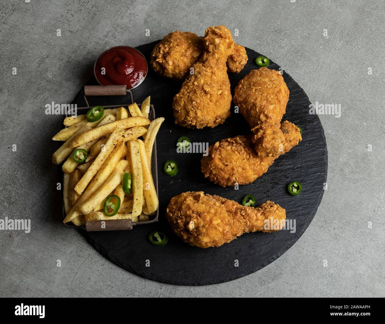 Breaded crispy fried chicken legs, french fries and sauce Stock Photo ...