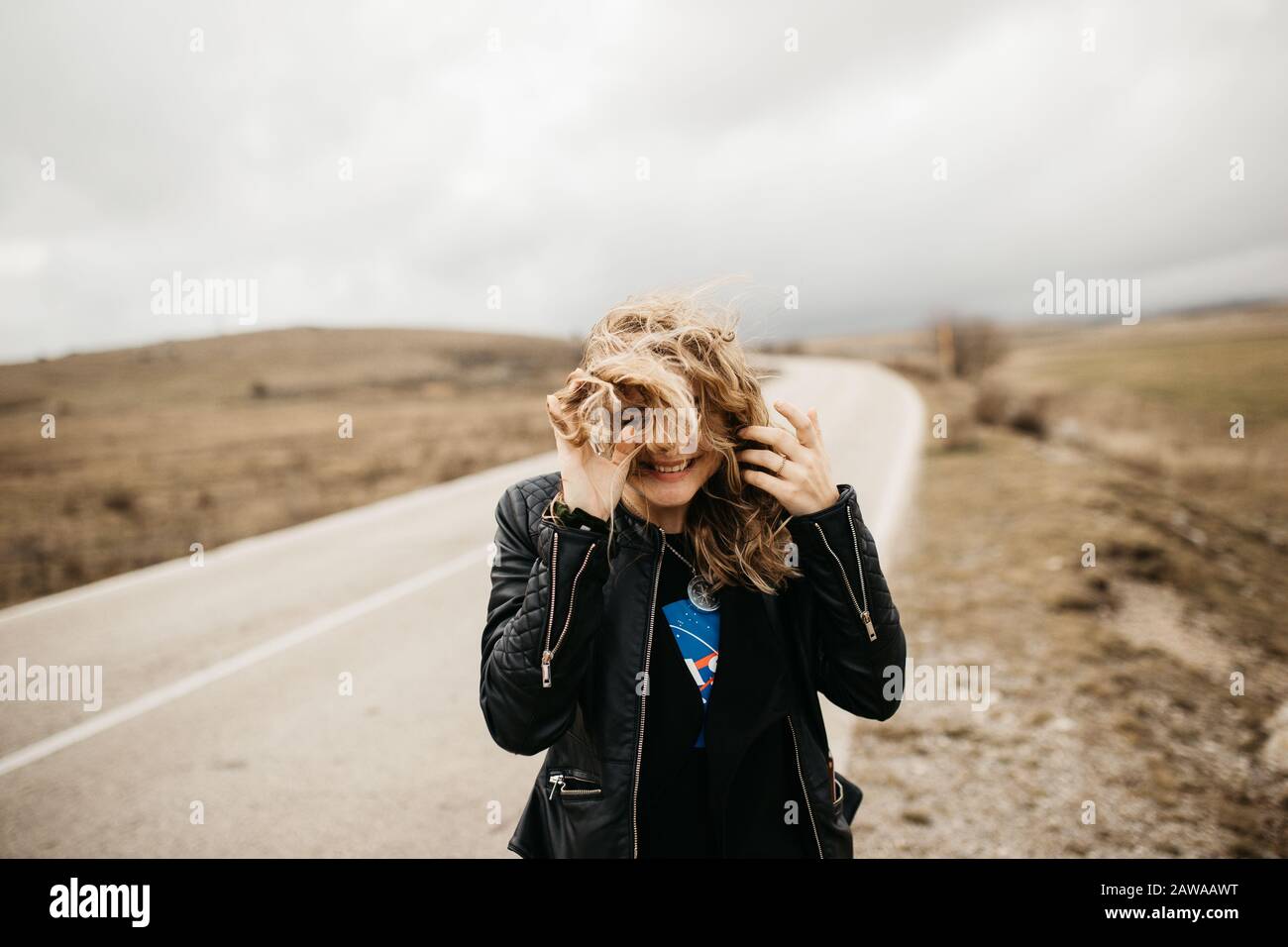 Strong wind blowing woman hi-res stock photography and images - Alamy