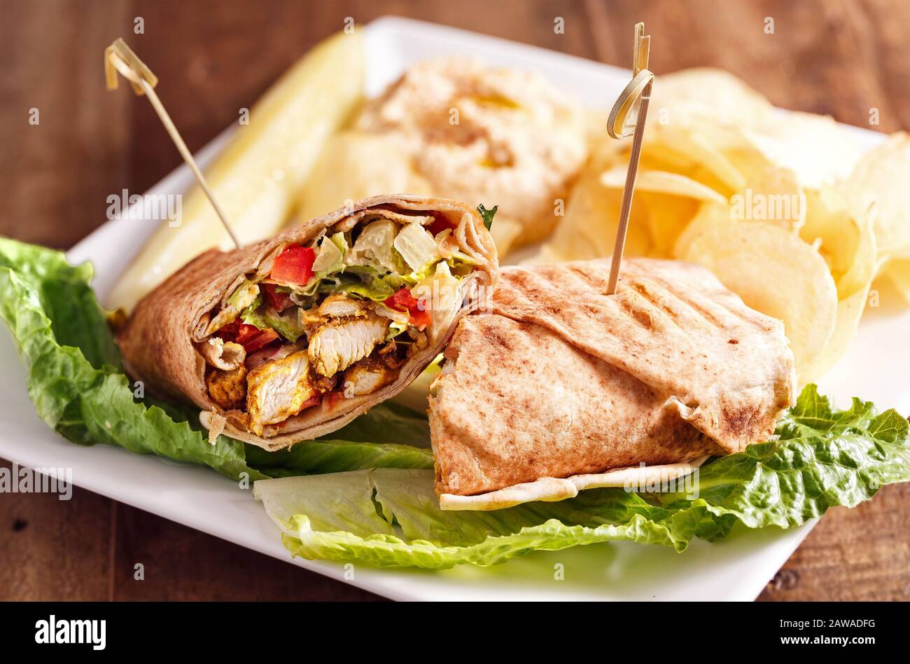Chicken Shawarma Wrap with Hummus and Potato Chips Stock Photo - Alamy