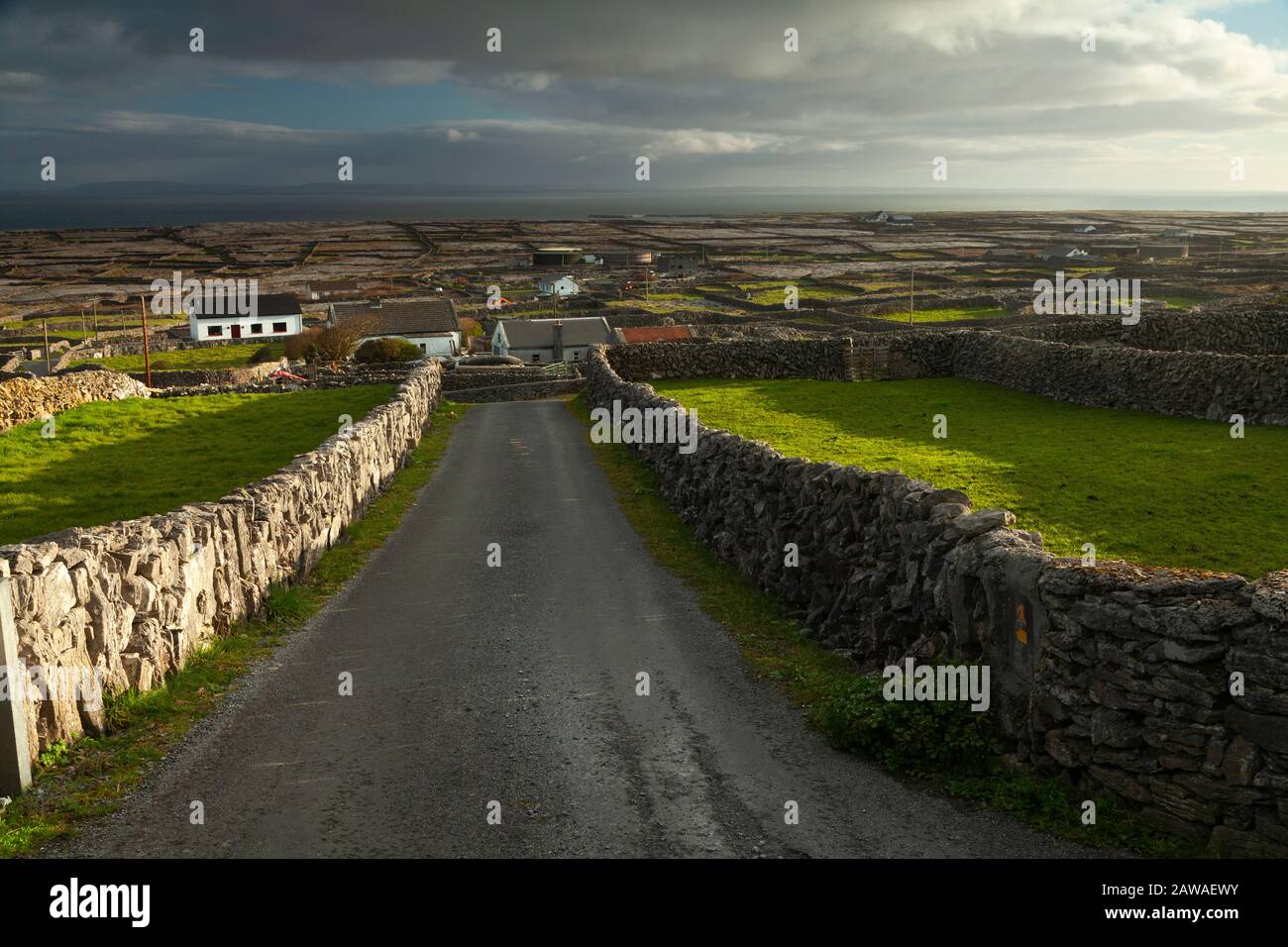 Road and view on Inishmaan island, middle of the Aran islands on the ...