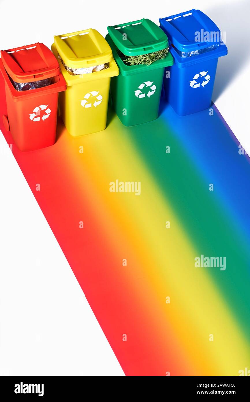 Four color coded recycle bins, isometric projection on geometric ...
