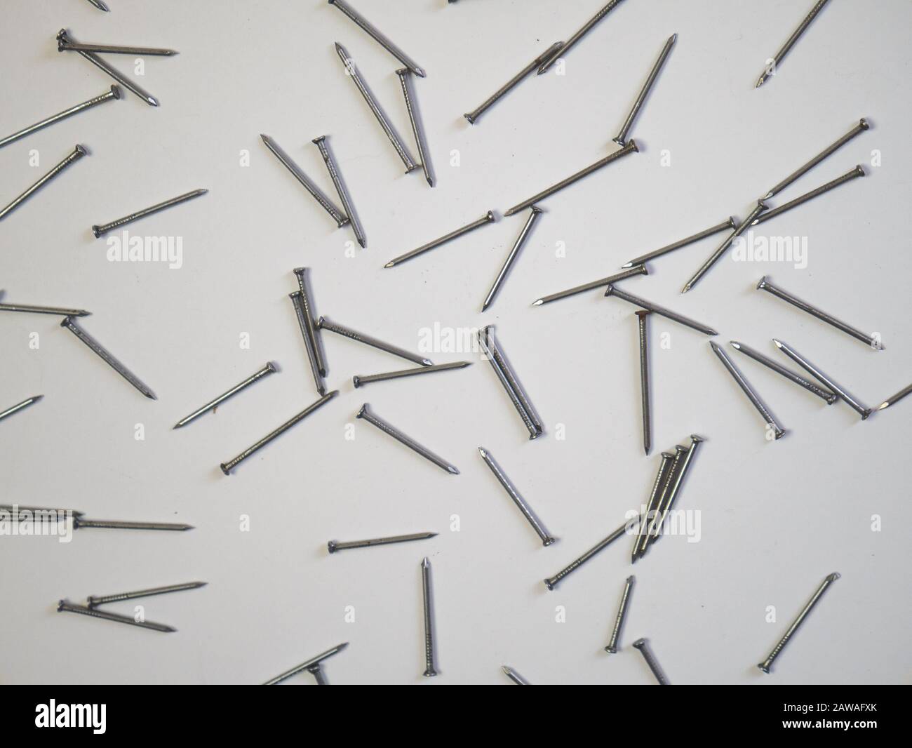 Flat lay nails on a white background. Copy space Stock Photo - Alamy