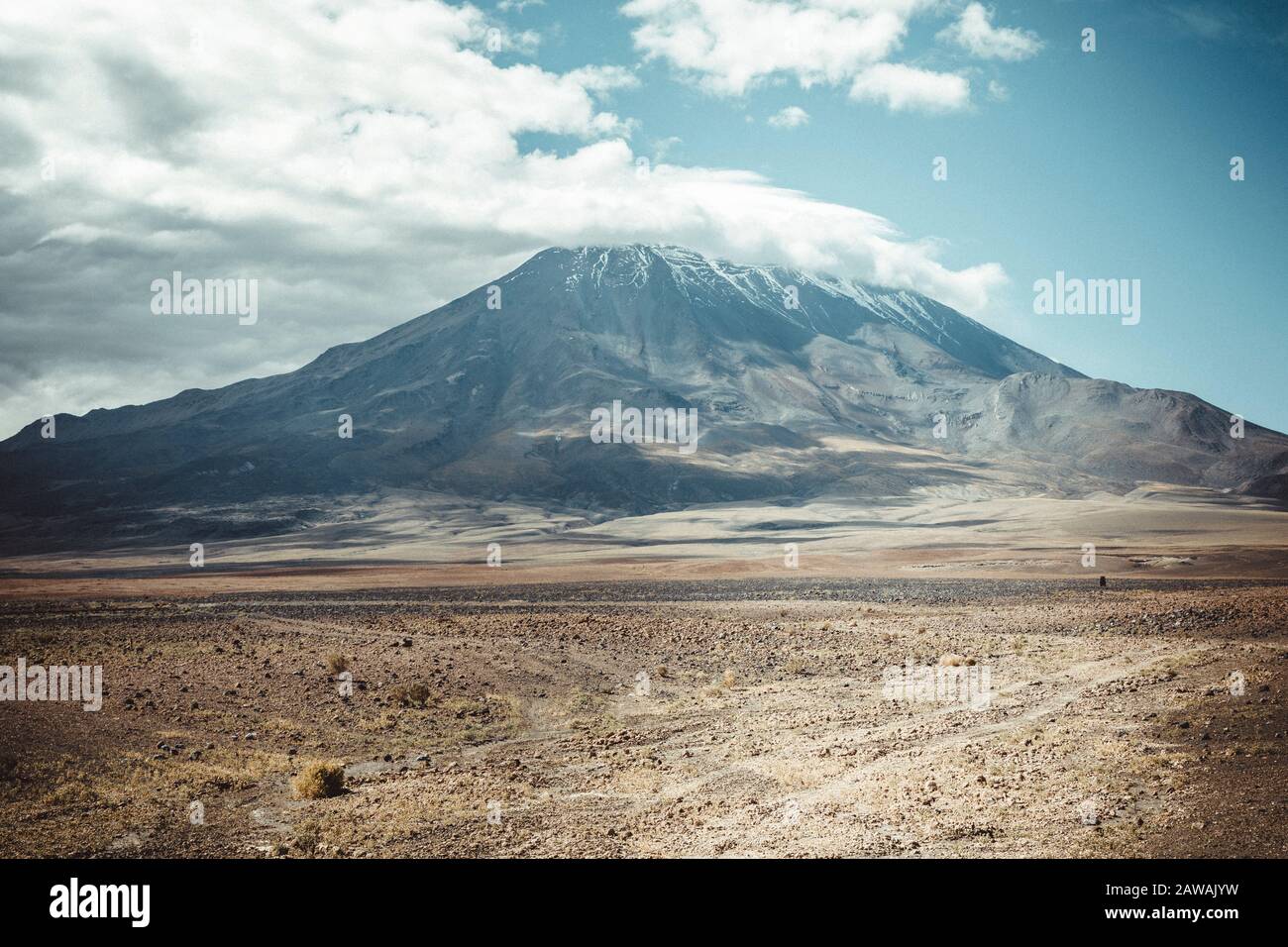 Volcano in atacama desert with clouds Stock Photo - Alamy