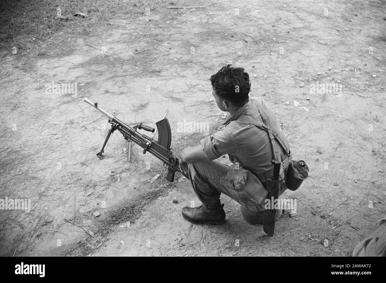 Borneo description: Soldier with a machine gun Date: February 1947 ...