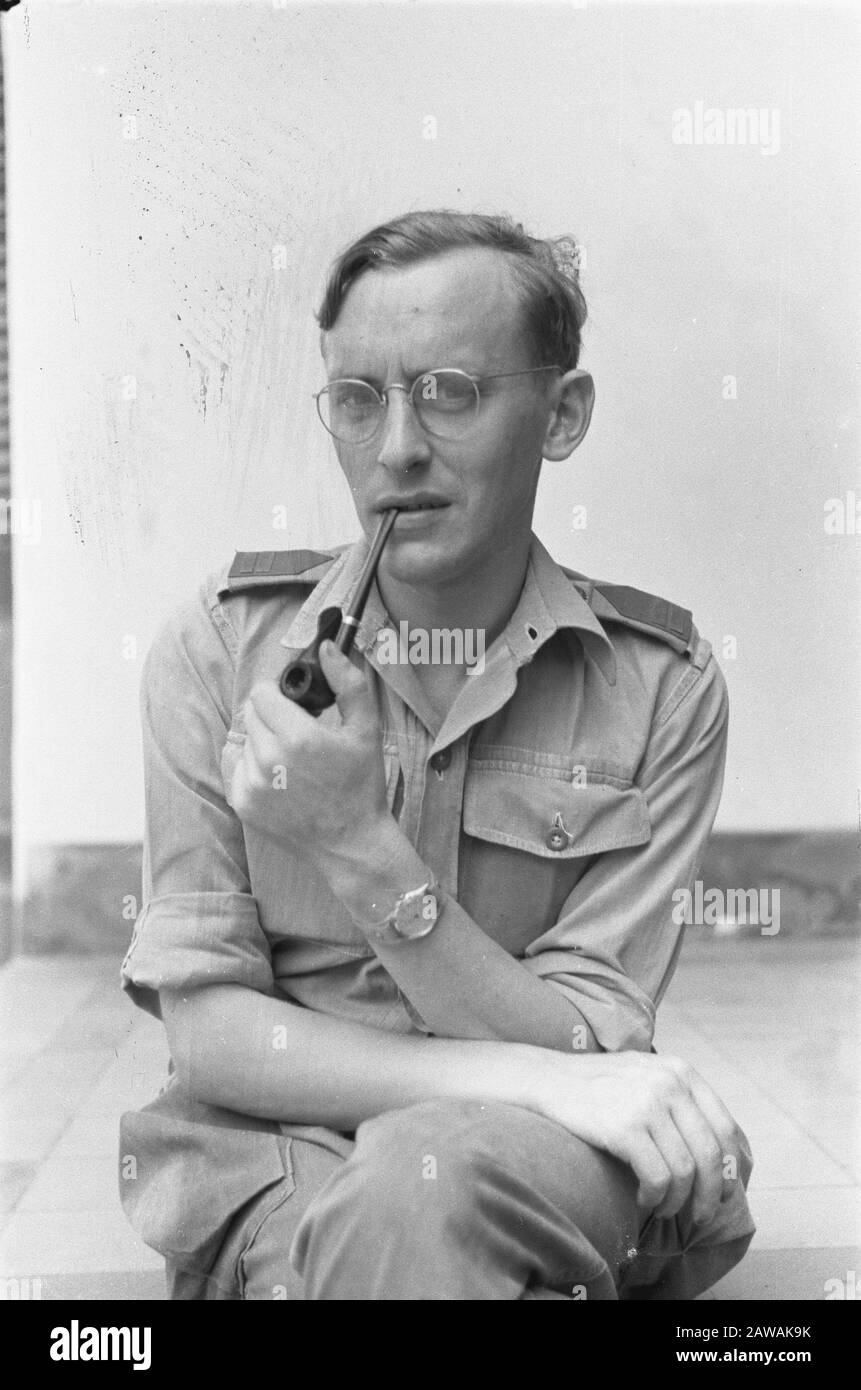 Passport photos V Soldier with wearing glasses, smoking pipe, shoulder ...