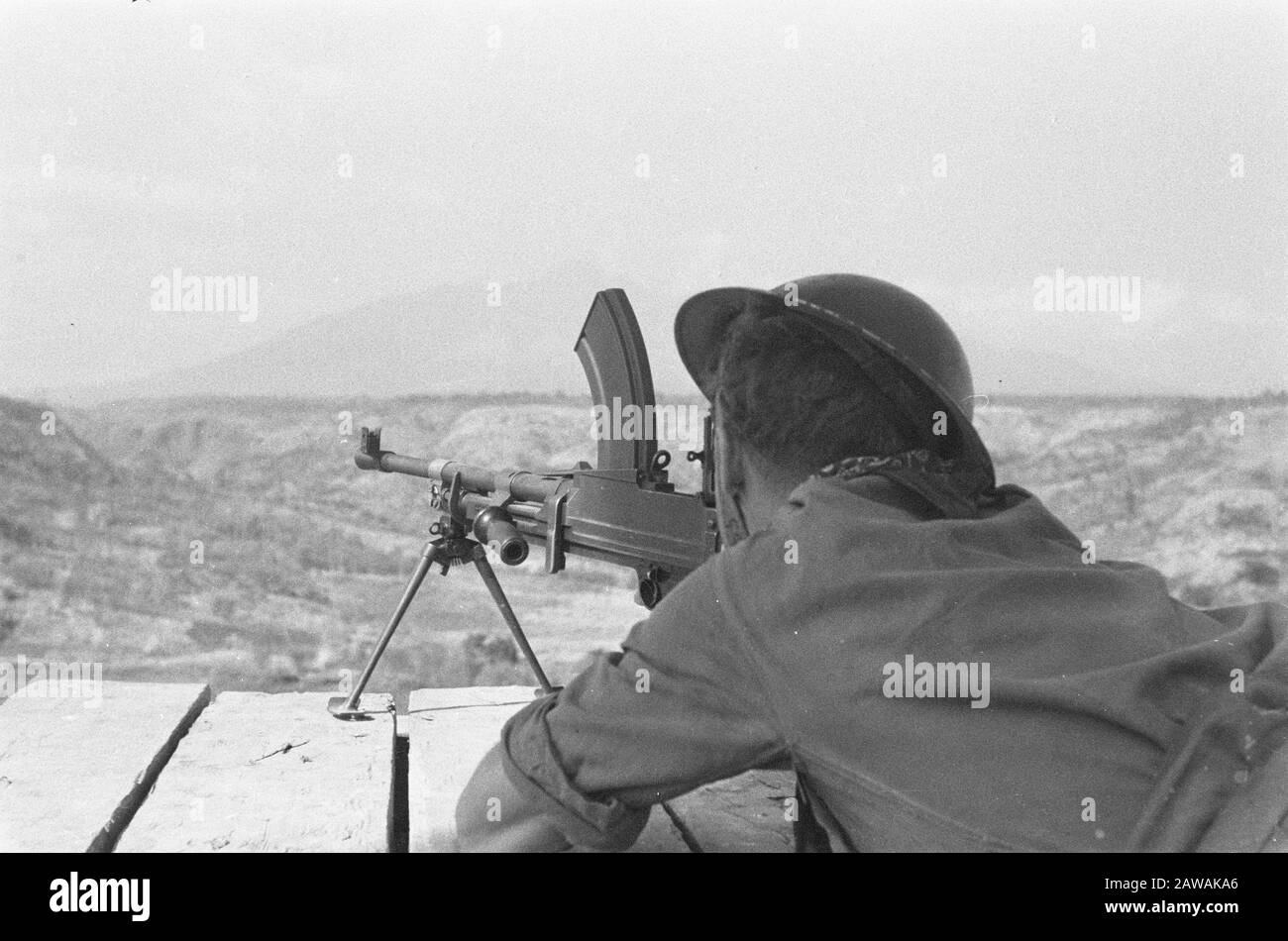 Soldier with machine gun Date: 1946 Location: Indonesia Dutch East ...