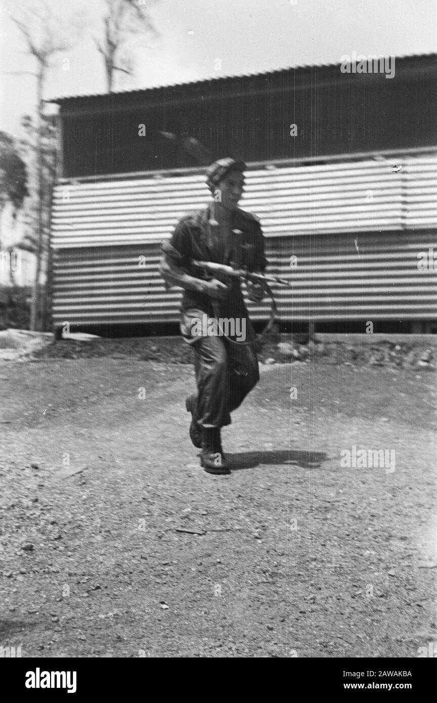 Report Hollandia description: Soldier with pistol-machine gun at the ...