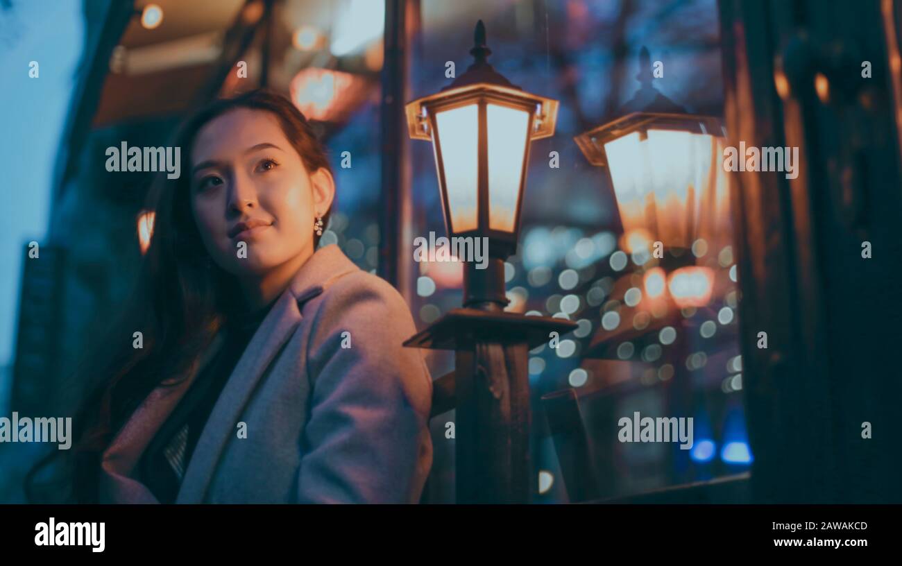 asian woman in the street in the night Stock Photo - Alamy