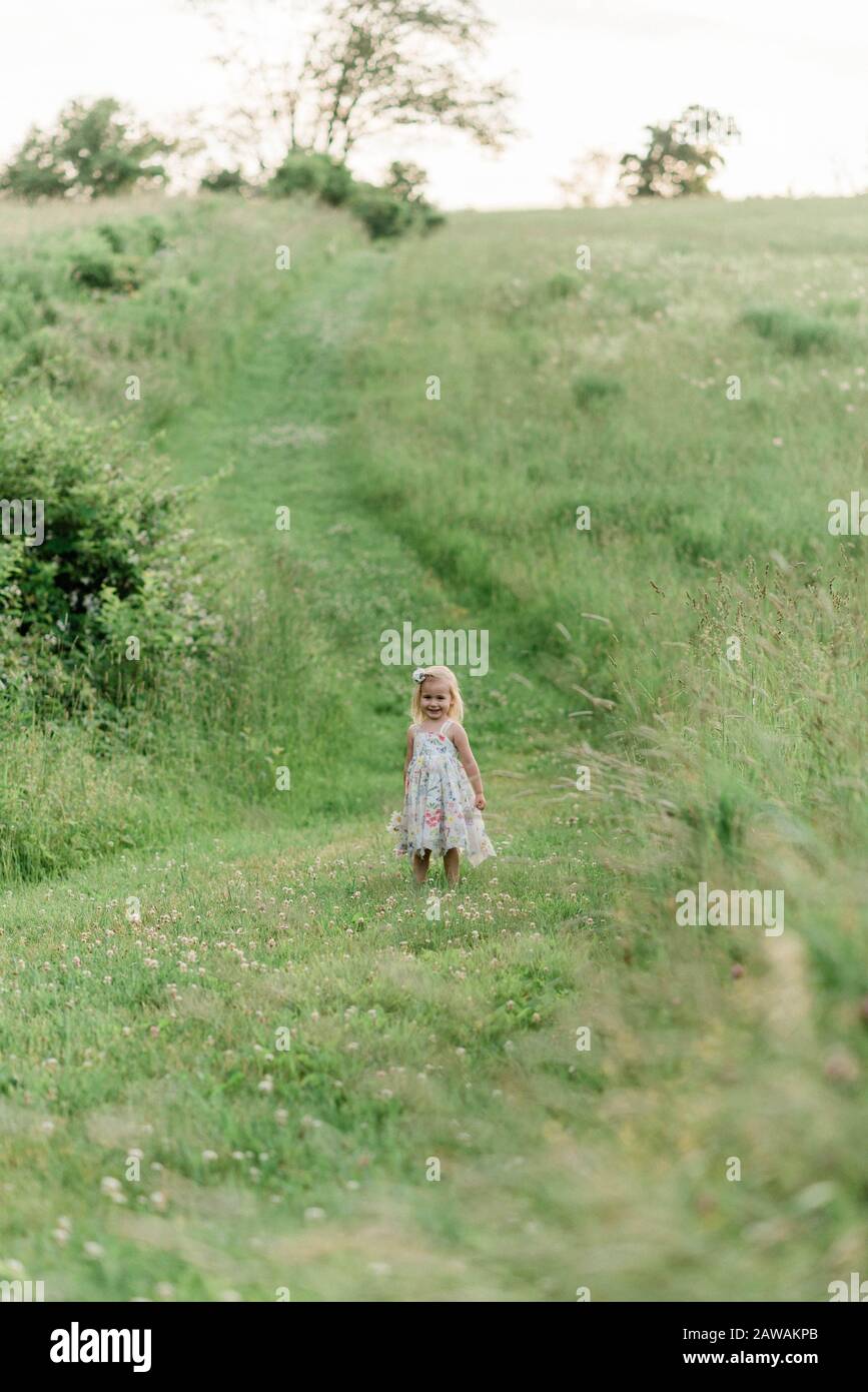 Girl Walking Through A Meadow High Resolution Stock Photography and ...