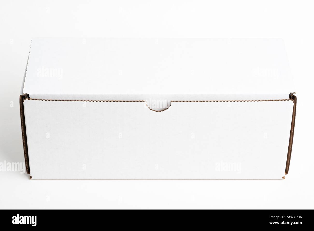 A close-up studio shot of a generic closed white packaging box set on a ...
