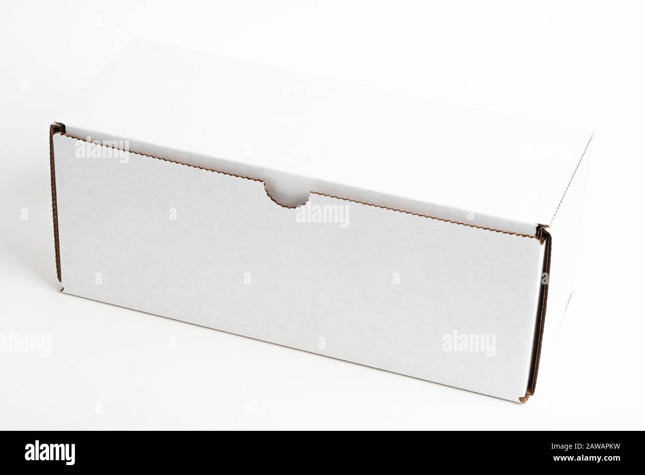 A close-up studio shot of a generic closed white packaging box set on a ...
