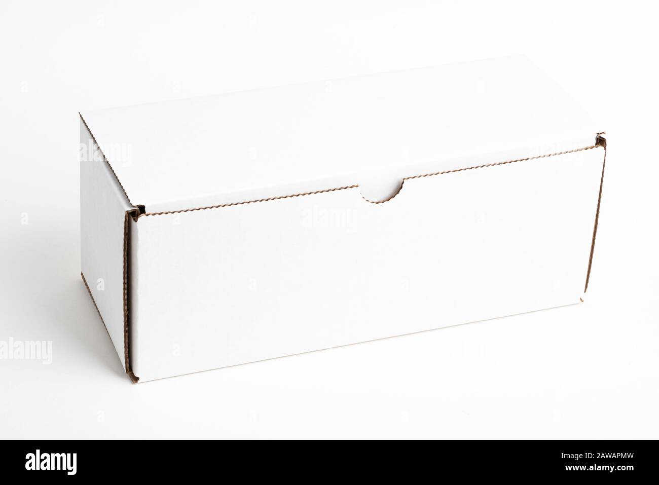 A close-up studio shot of a generic closed white packaging box set on a ...