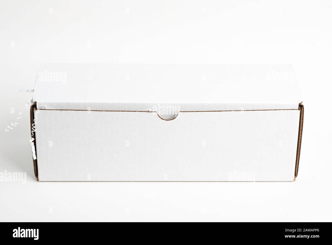 A close-up studio shot of a generic closed white packaging box set on a ...