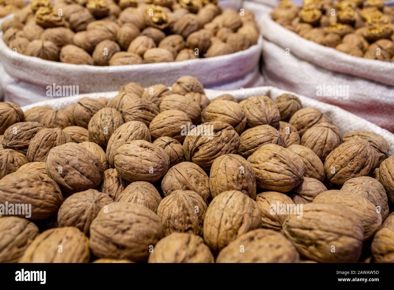 Stack of shelled walnuts in sack Stock Photo - Alamy