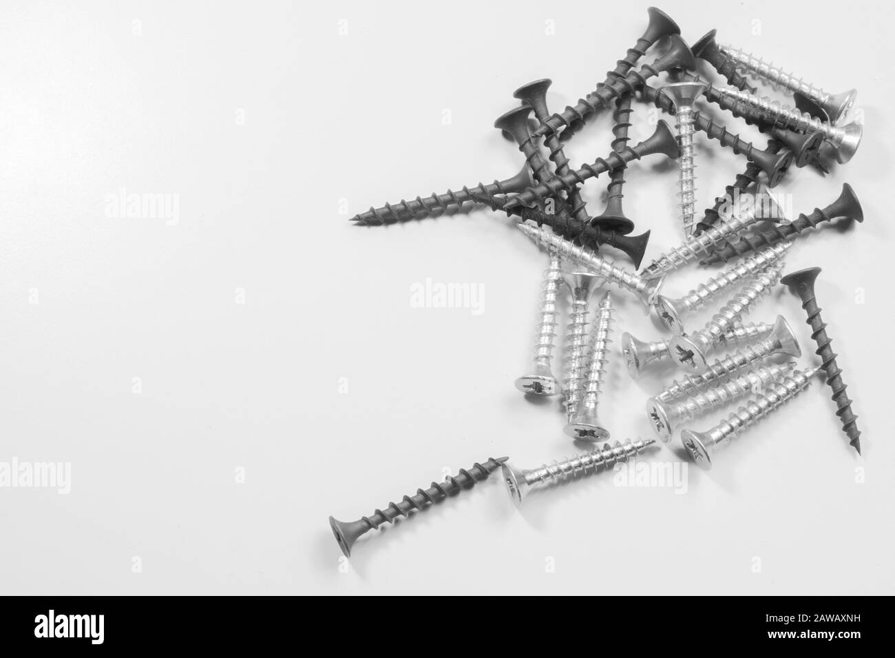 Steel screw on a white background. working tools Stock Photo - Alamy