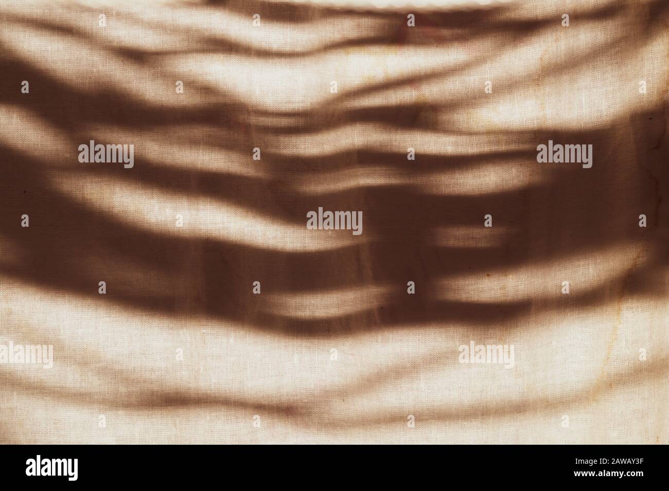 Brown fabric texture. lights and shadows on the cloth. textile ...