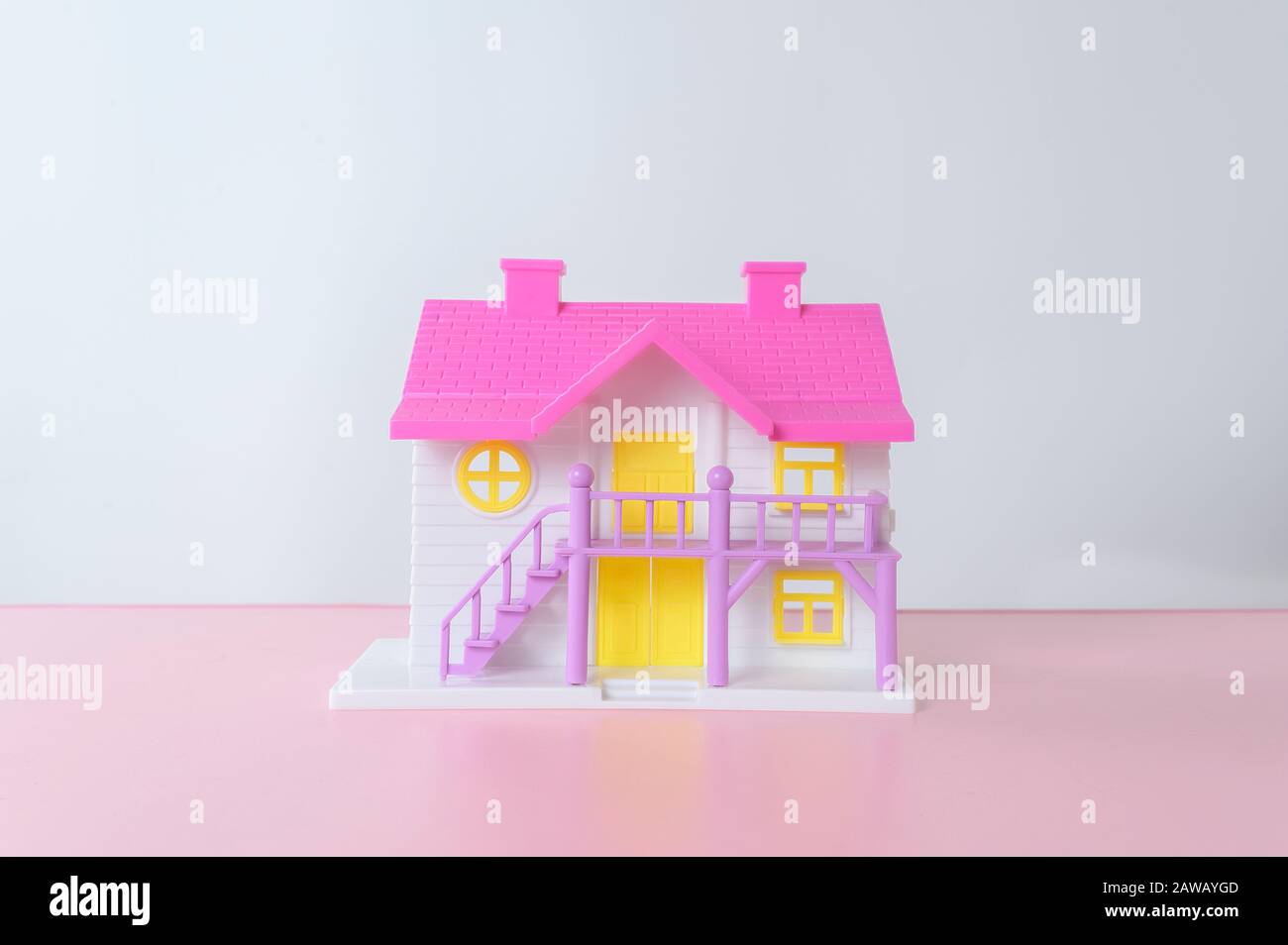 Colorful toy house on white background. Conceptual real estate property ...