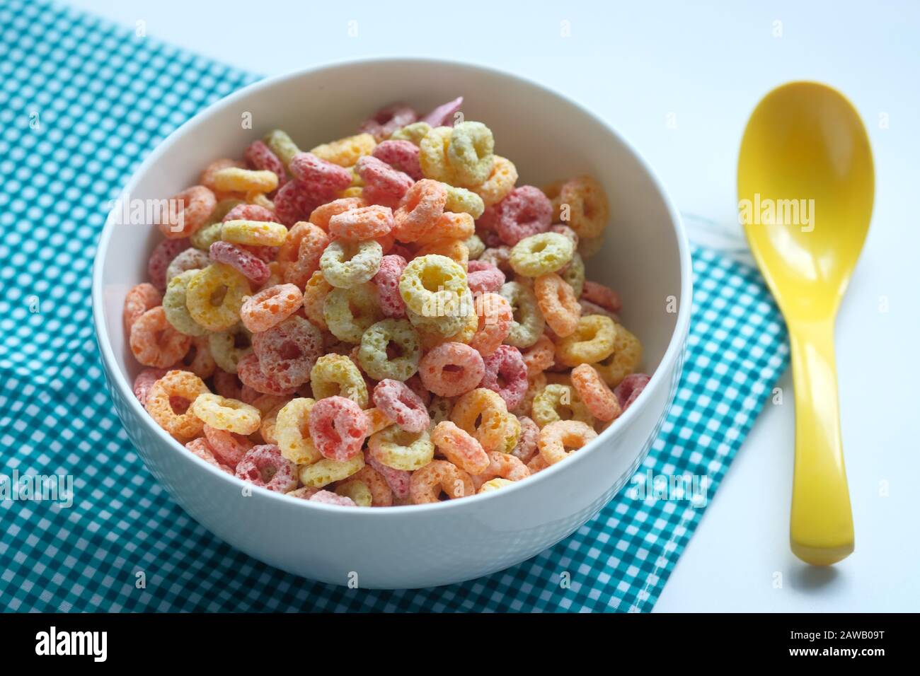 colorful ring corn flakes in a bowl with spoon Stock Photo - Alamy