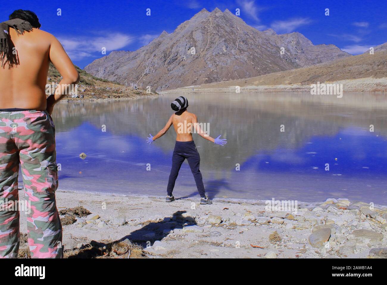 tourists are enjoying a moment in front of frozen sela lake at sela ...